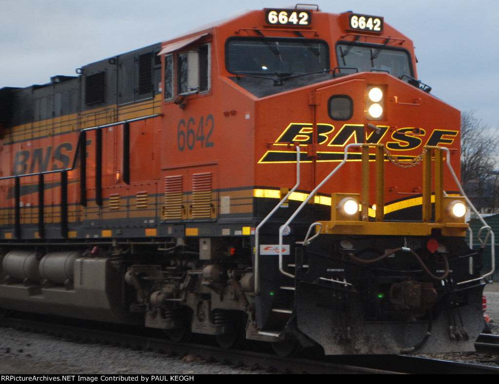 Up Close shot of BNSF 6642 as my flash reflects off her BNSF Swoosh Logo as she departs eastward ...